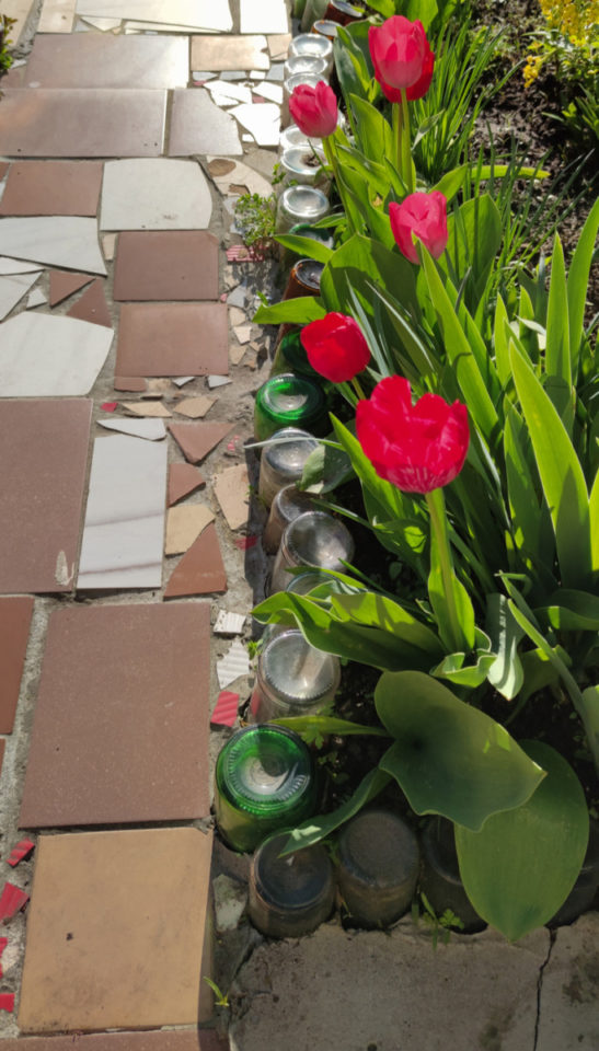 20 Epic Ways To Reuse Glass Bottles in Your Garden
